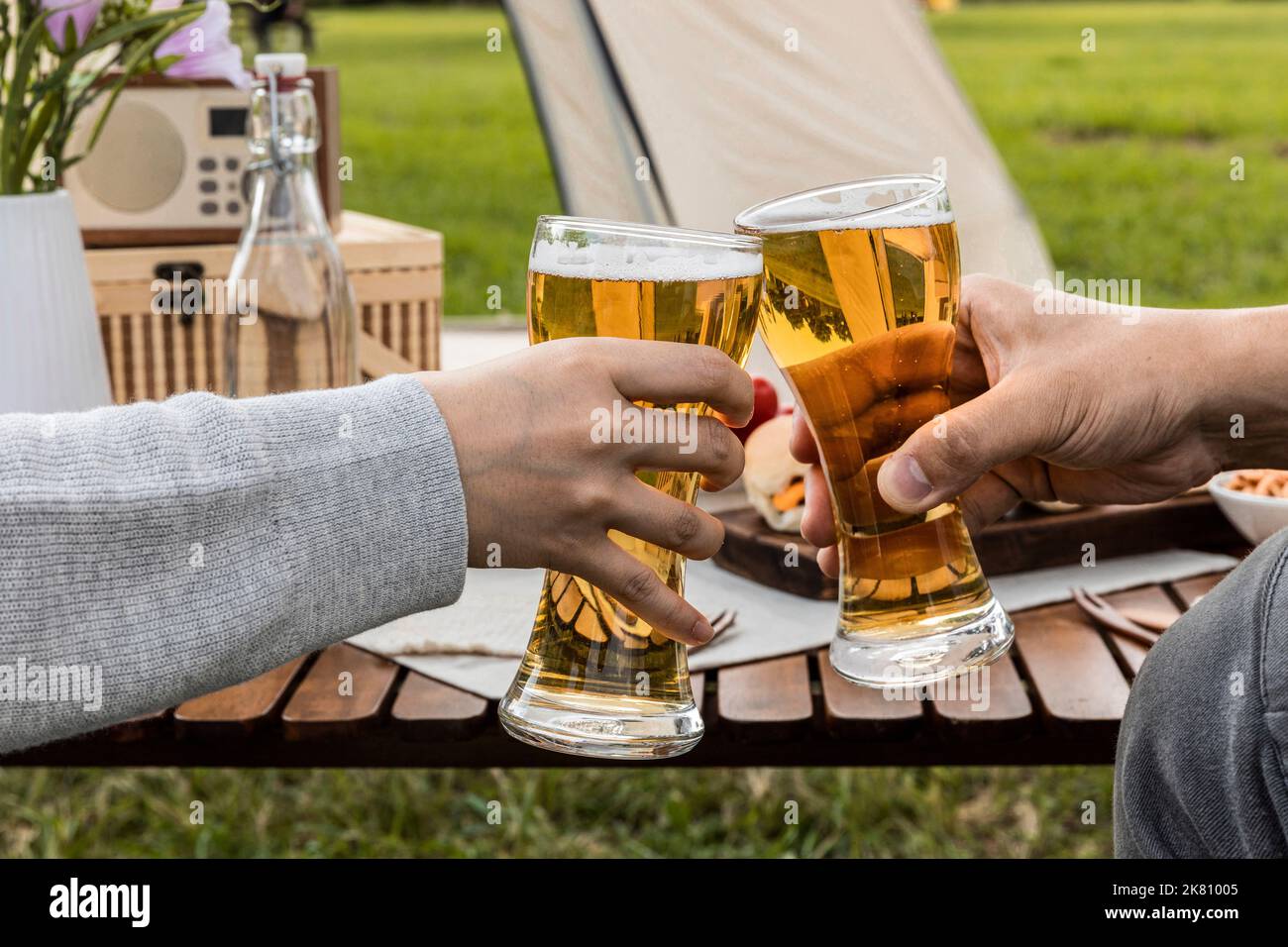 camping mood aesthetics drinking beer Stock Photo - Alamy