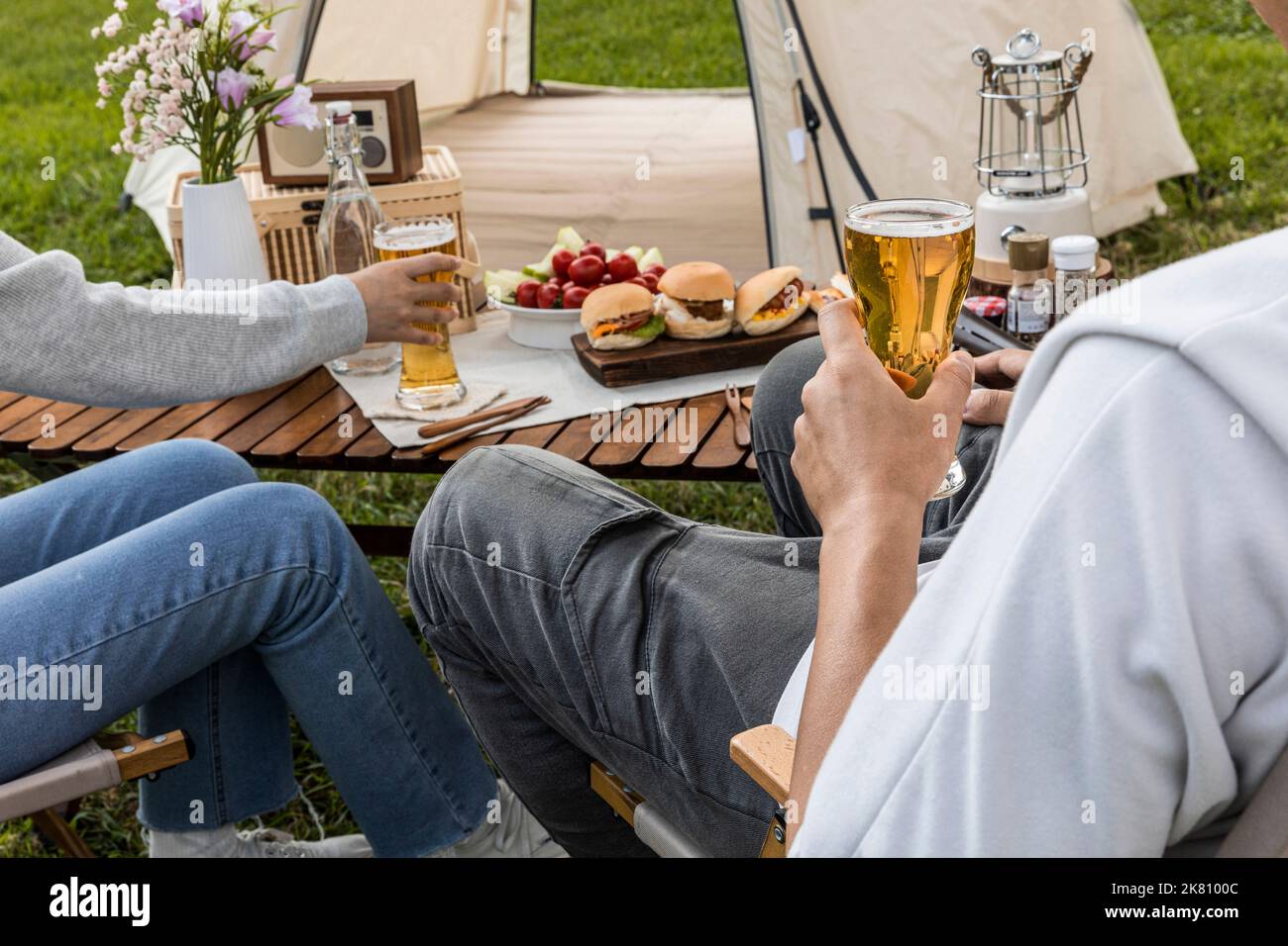 camping mood aesthetics drinking beer Stock Photo - Alamy