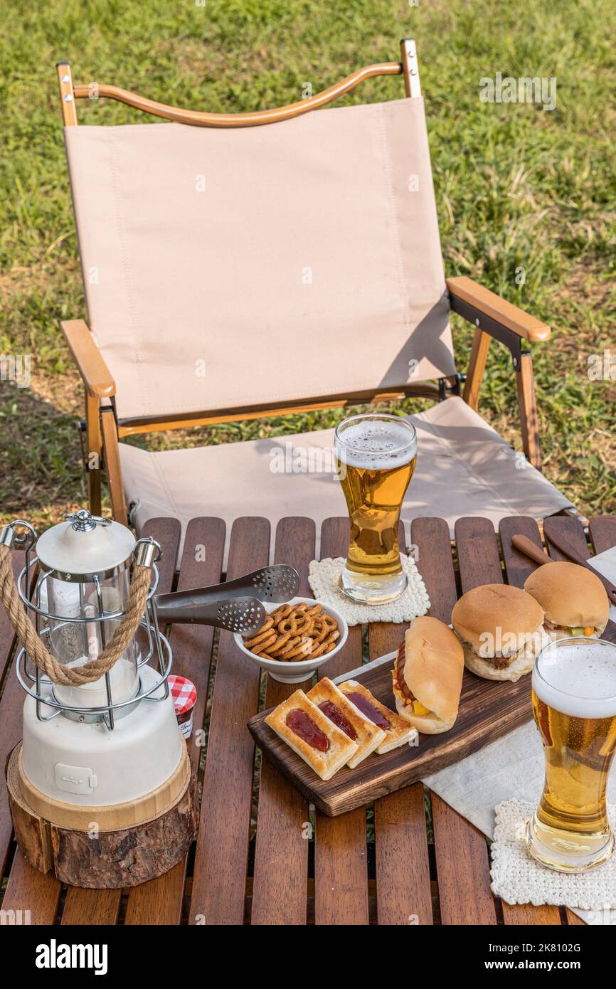 camping mood aesthetics beer and side dishes served on the tablet Stock ...