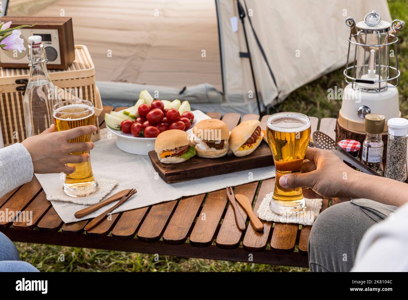 camping mood aesthetics drinking beer Stock Photo - Alamy