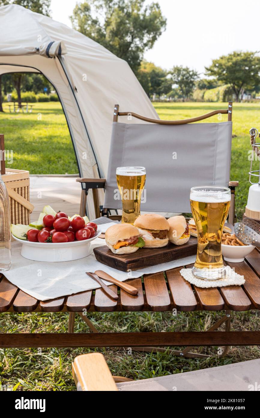 camping mood aesthetics beer and side dishes served on the tablet Stock ...