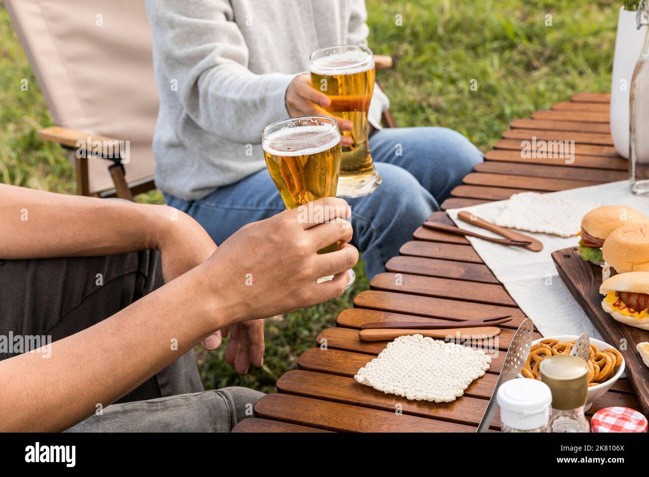 camping mood aesthetics drinking beer Stock Photo - Alamy