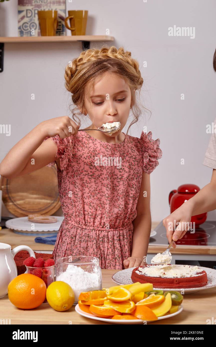 Little girl is making a homemade cake with an easy recipe at kitchen ...