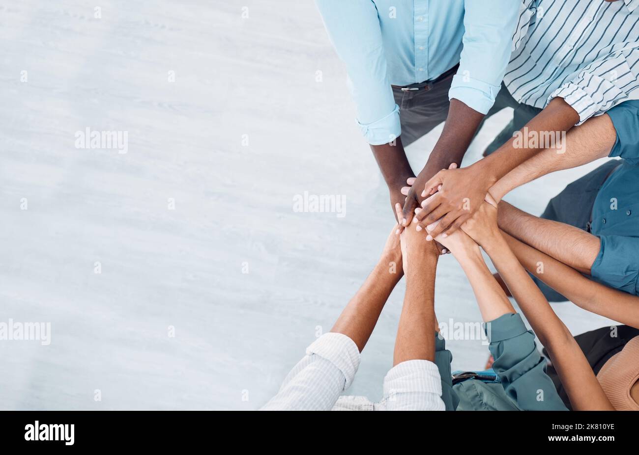 Teamwork, motivation and diversity hands stacked with mock up corporate ...