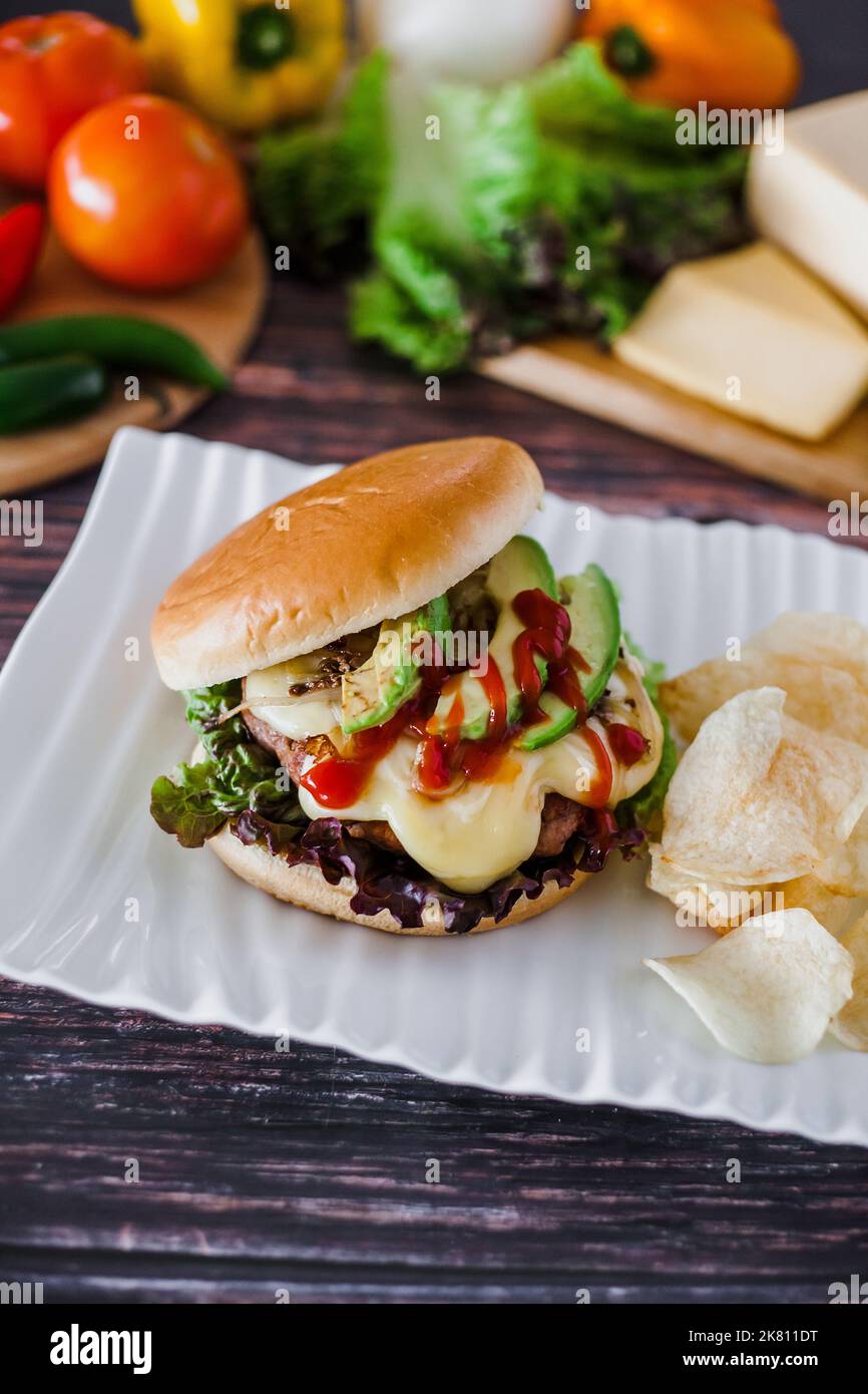 mexican burger with chips and avocado on table food with ingredients in ...