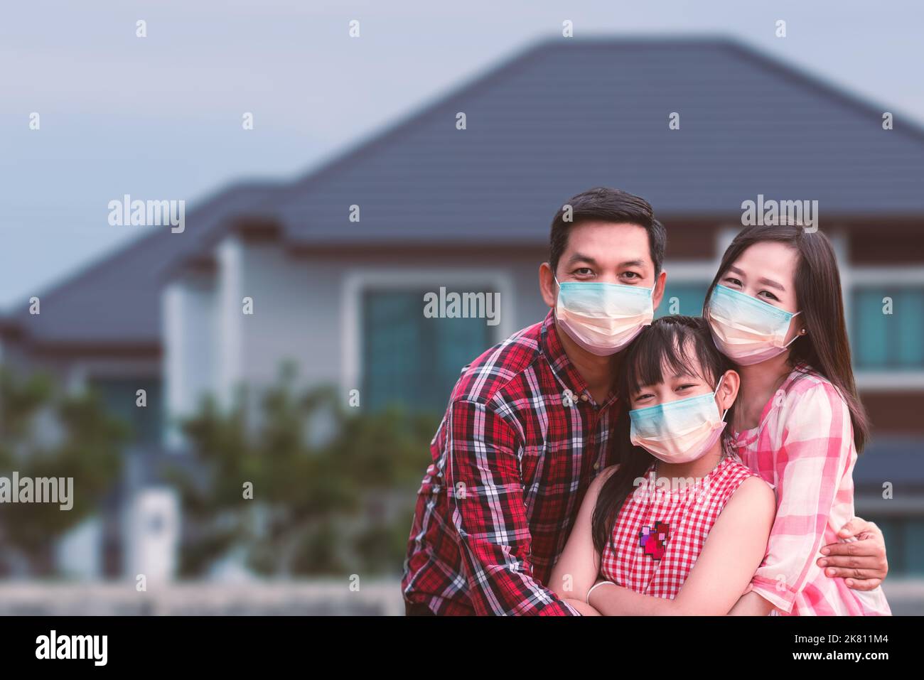 Family wearing a face mask to prevent virus Covid-19 out house .Father ...