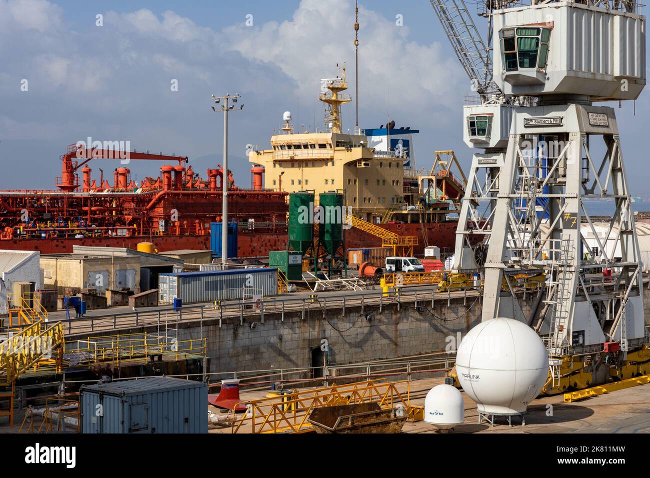 Harbor and the Bay of Gibraltar with its colorful rail cranes ...
