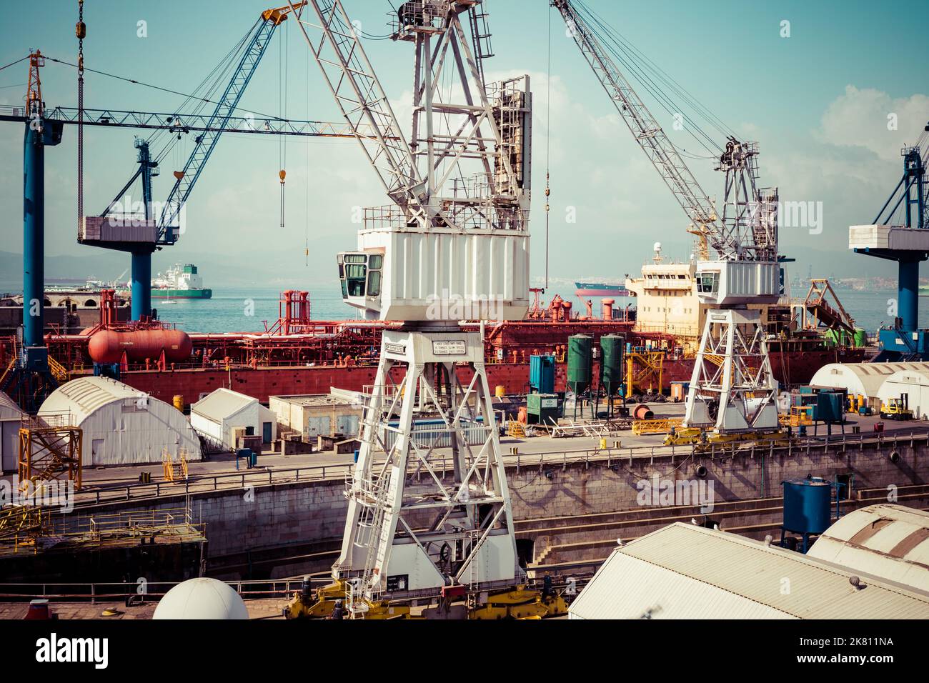 Harbor and the Bay of Gibraltar with its colorful rail cranes ...