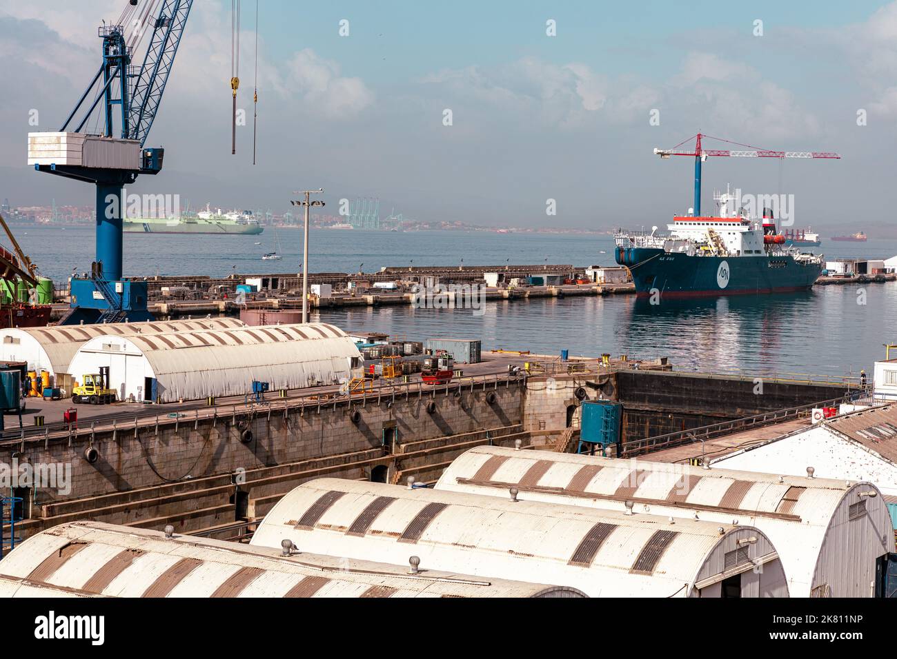 Harbor and the Bay of Gibraltar with its colorful rail cranes ...