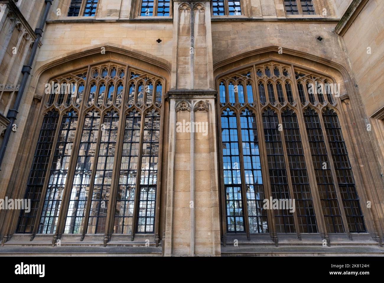 Facade with airy windows of the Divinity School in Oxford, England ...