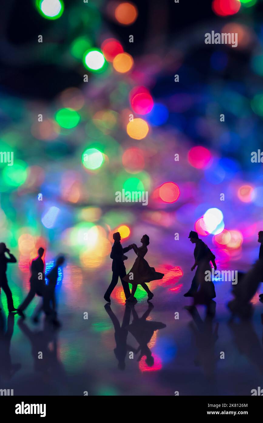 Miniature people toy - A couple dancing on the street together among ...