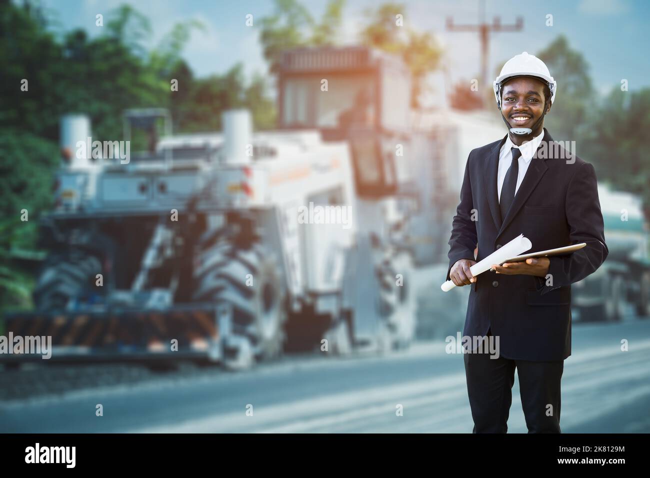 African Engineer Architecture Manager holding a tablet for working on ...