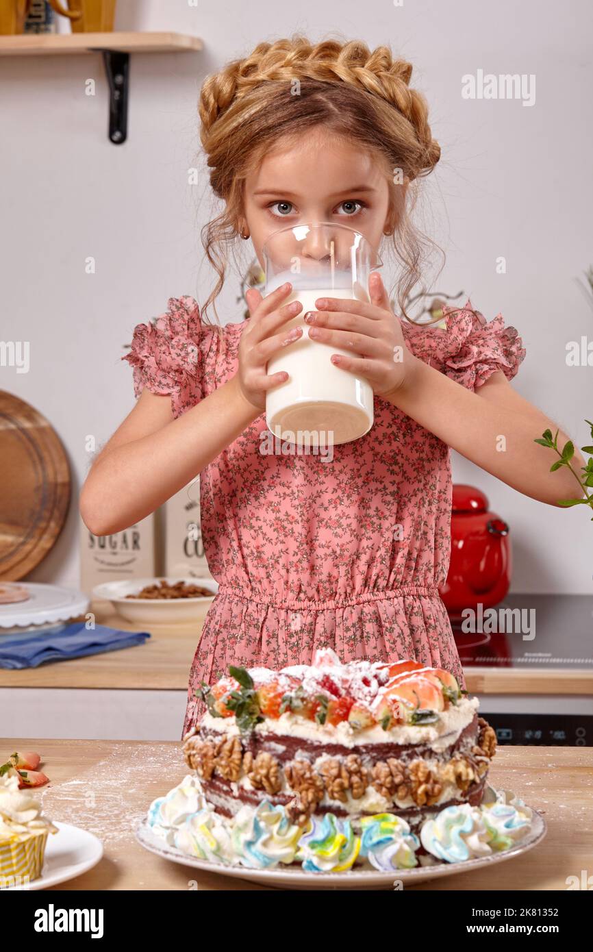 Little girl is making a homemade cake with an easy recipe at kitchen ...