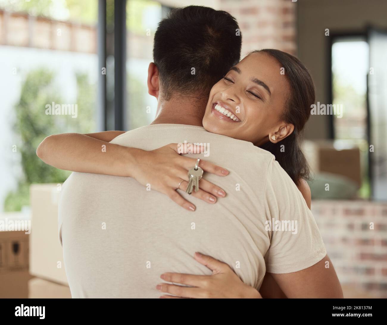 We finally have a place to call our own. a woman embracing her partner ...