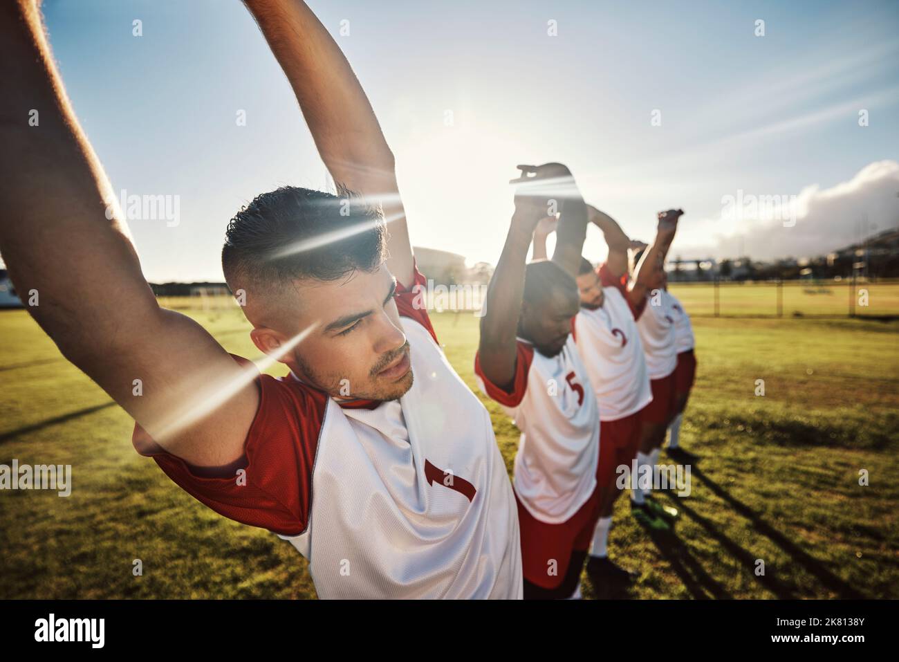 Men football, team and stretching for fitness, wellness and health on a ...