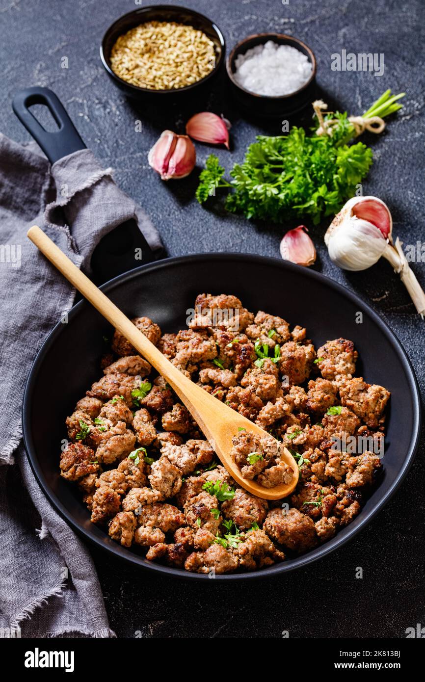fried Italian sausage of freshly ground pork meat and spices in skillet ...