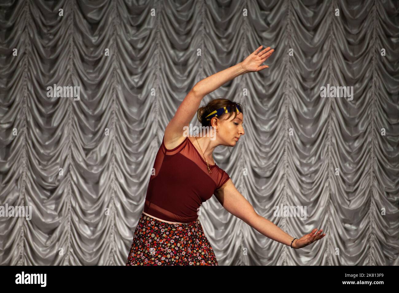 Ballerina shows dance. Girl dancing on stage. Choreography lesson ...