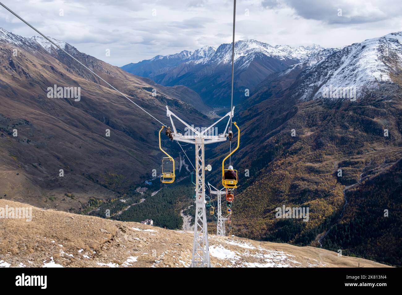 Mountain landscape with chairs of a single-seat cable car Stock Photo ...