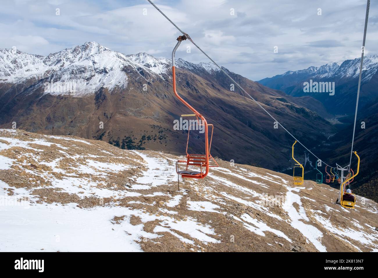 Mountain landscape with chairs of a single-seat cable car Stock Photo ...
