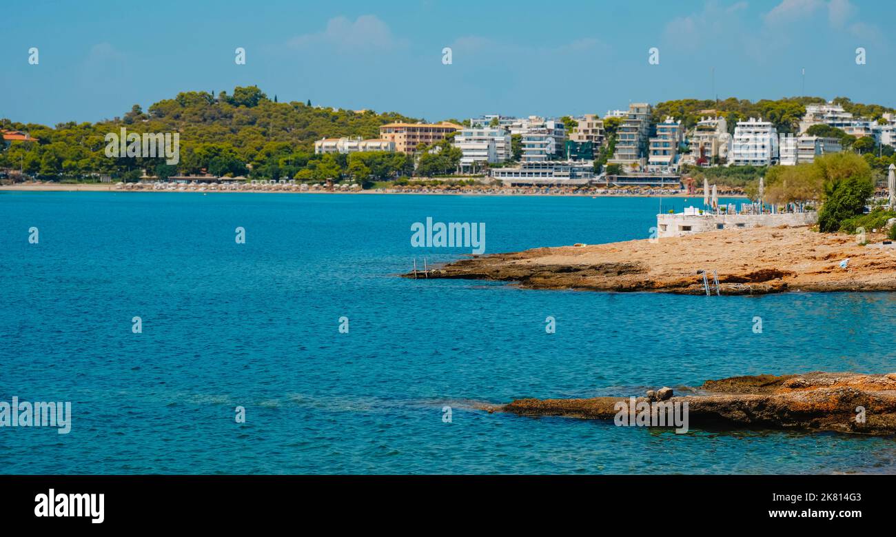 a view of the rocky coast landforms at the Vouliagmeni bay in ...