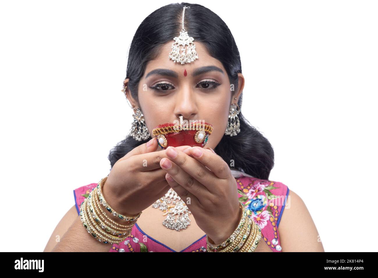 Indian woman holding Diya oil lamps for the Diwali festival isolated ...