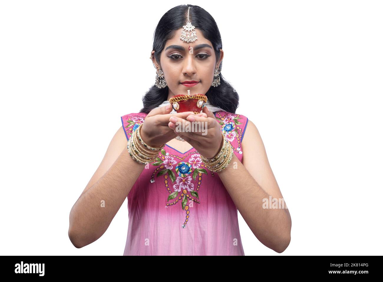 Indian woman holding Diya oil lamps for the Diwali festival isolated ...