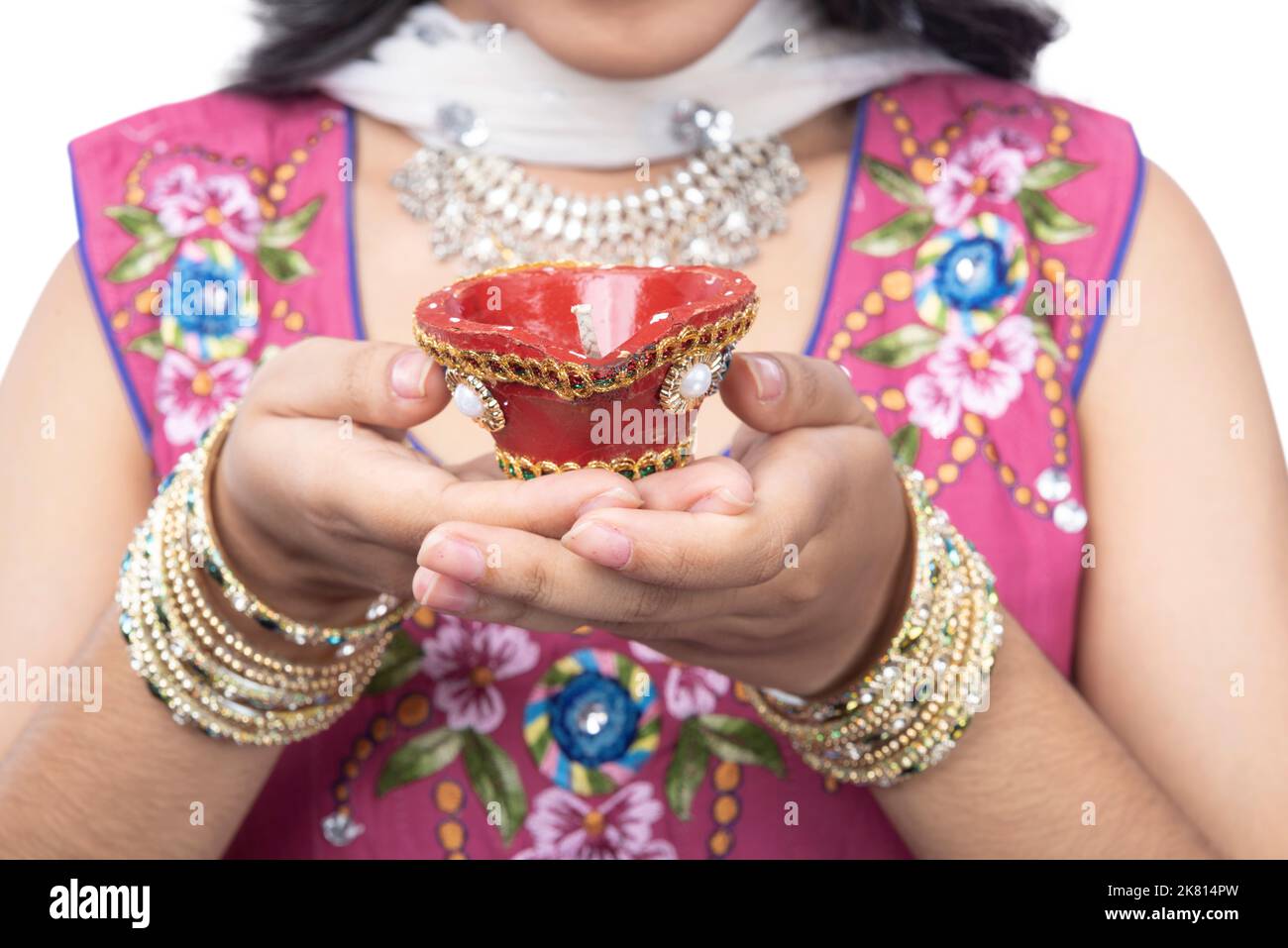 Woman hand holding Diya oil lamps for the Diwali festival isolated over ...