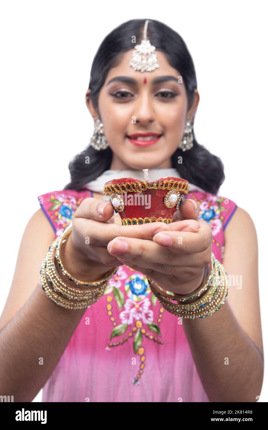 Indian woman holding Diya oil lamps for the Diwali festival isolated ...