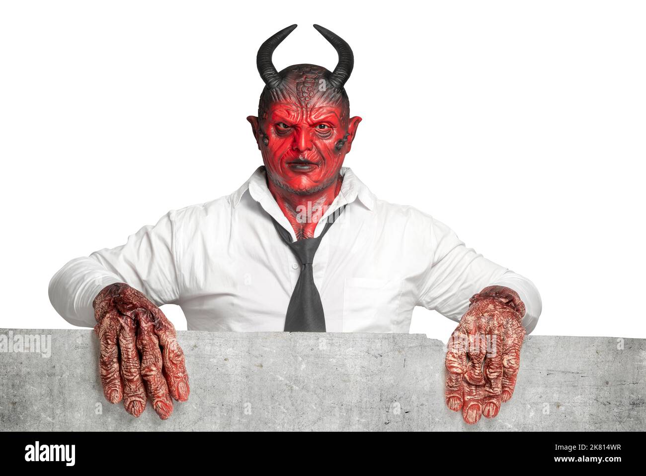 Devilman standing behind the wall isolated over white background ...