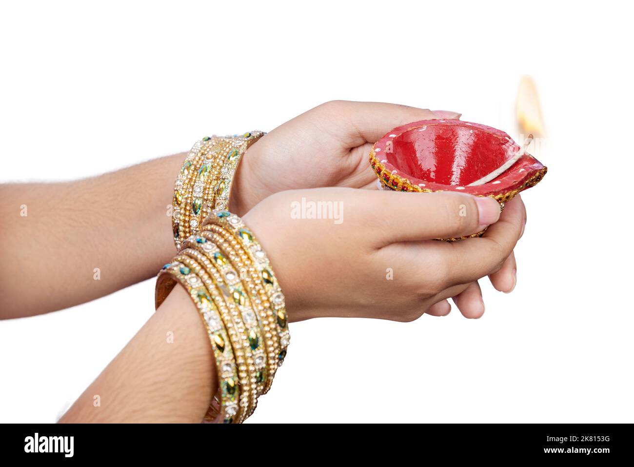 Woman hand holding Diya oil lamps for the Diwali festival isolated over ...
