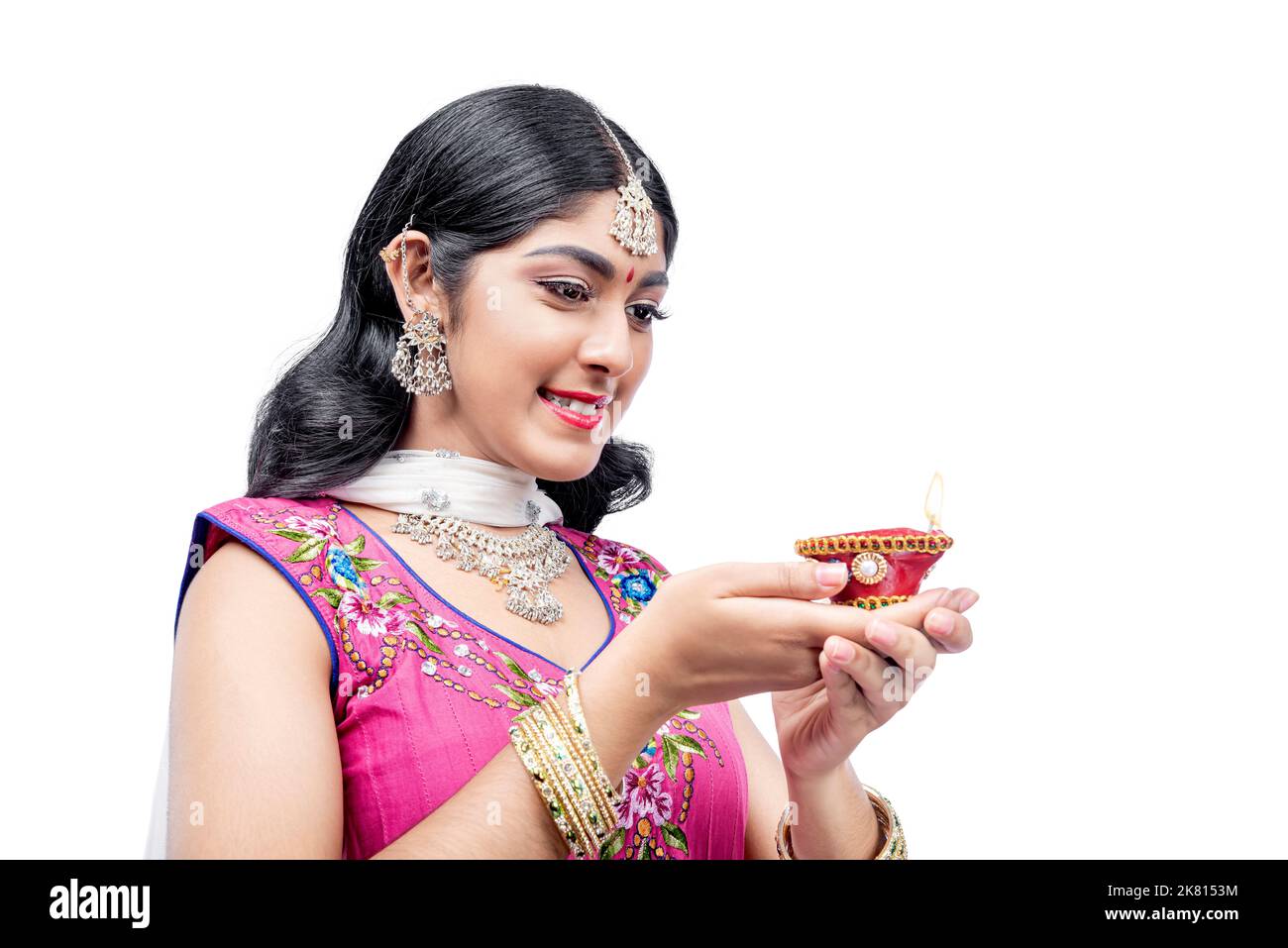 Indian woman holding Diya oil lamps for the Diwali festival isolated ...