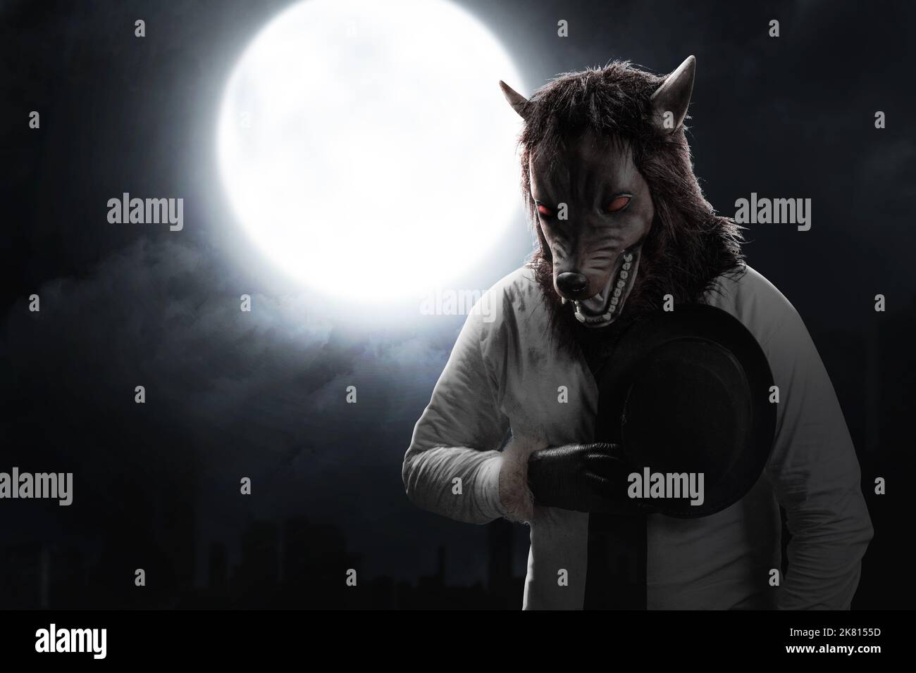 A werewolf with a full moon and night scene background. Halloween ...