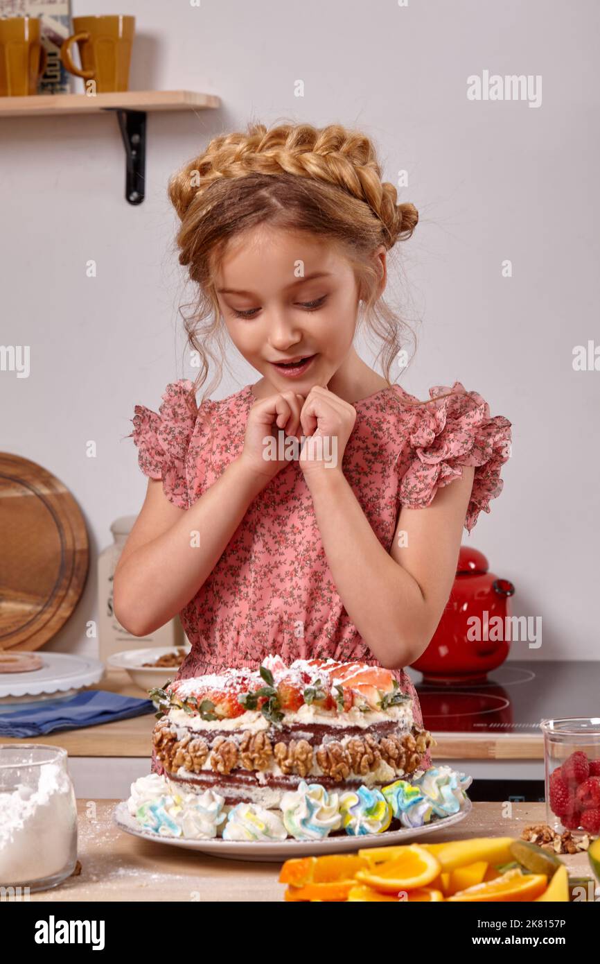 Little girl is making a homemade cake with an easy recipe at kitchen ...