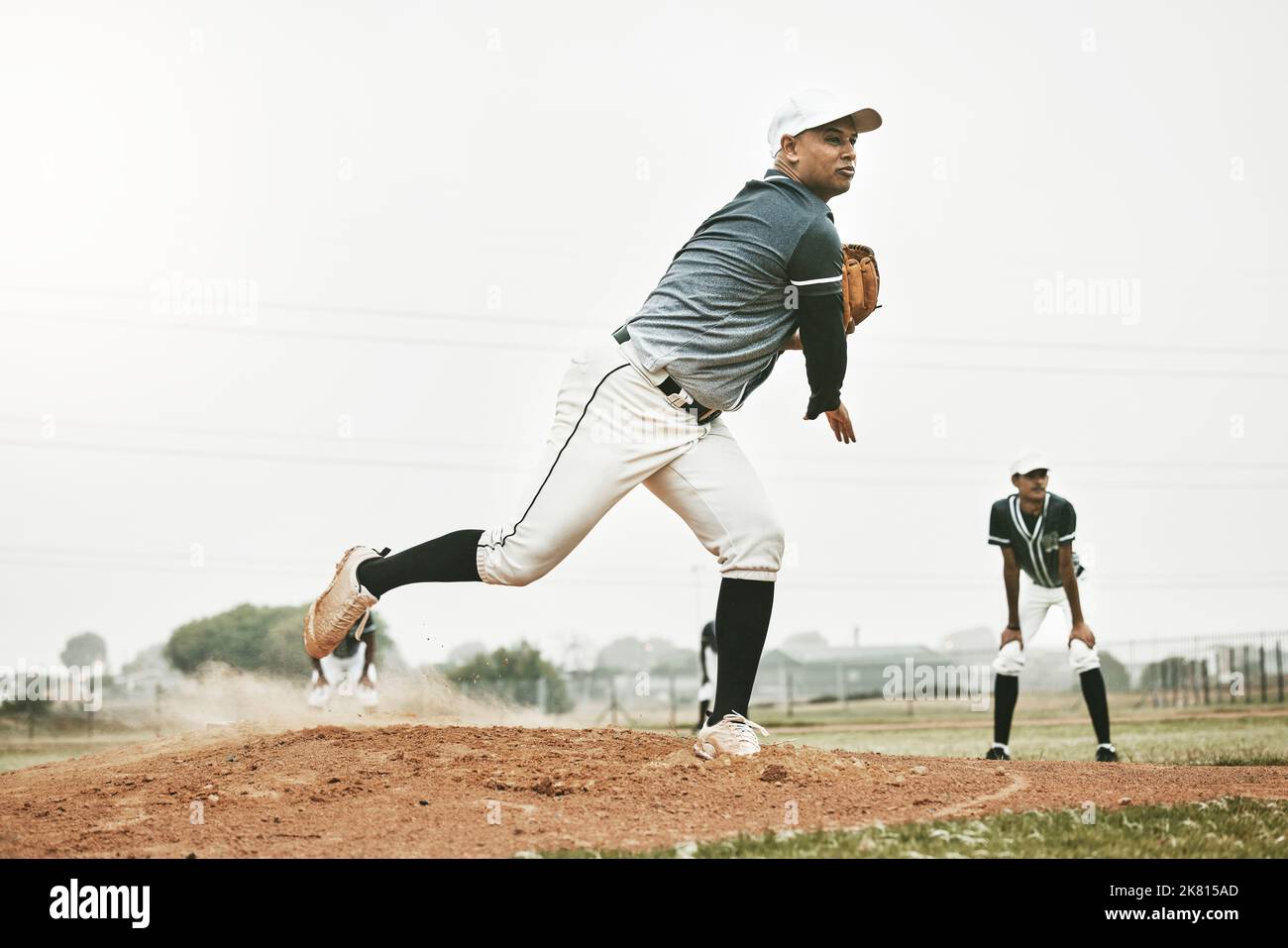 Baseball, pitch and team sports of a man pitcher busy with teamwork ...