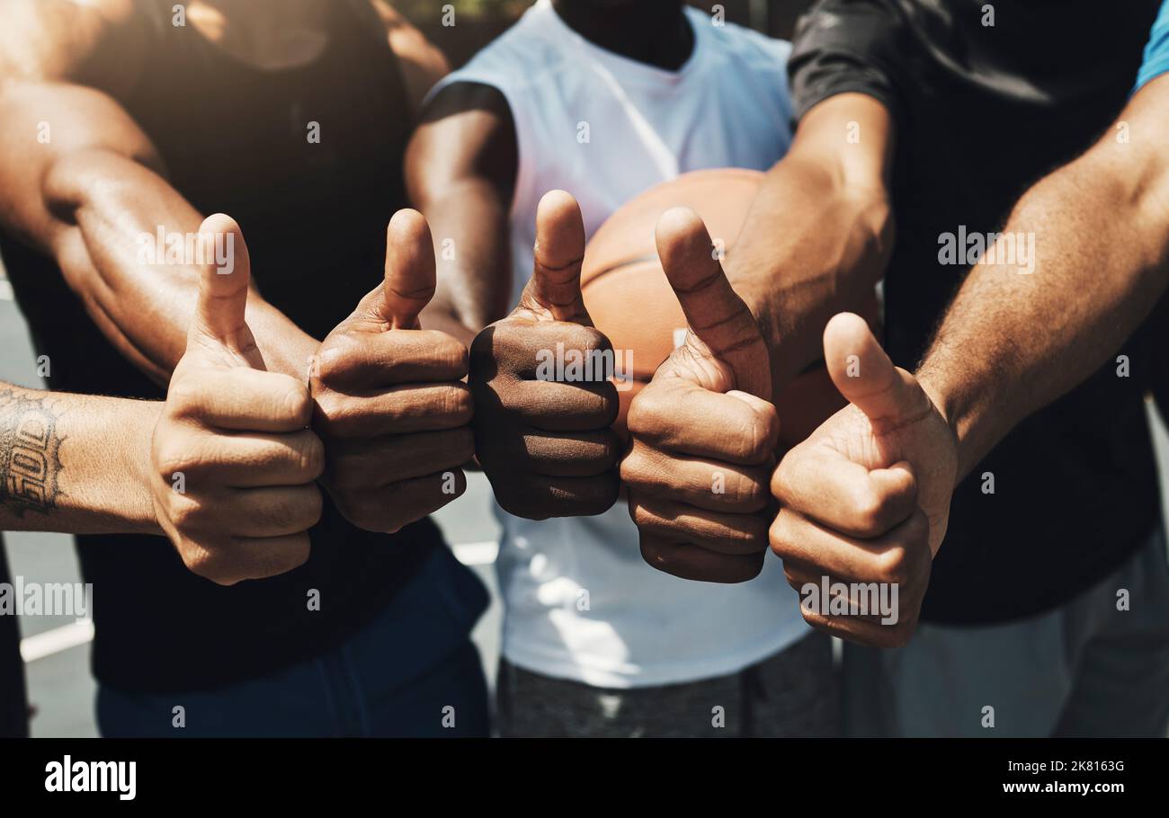 Basketball men, hands and thumbs up in group outdoor for sports with ...