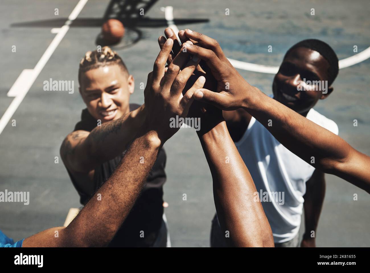High five, teamwork and basketball in closeup for support, motivation ...
