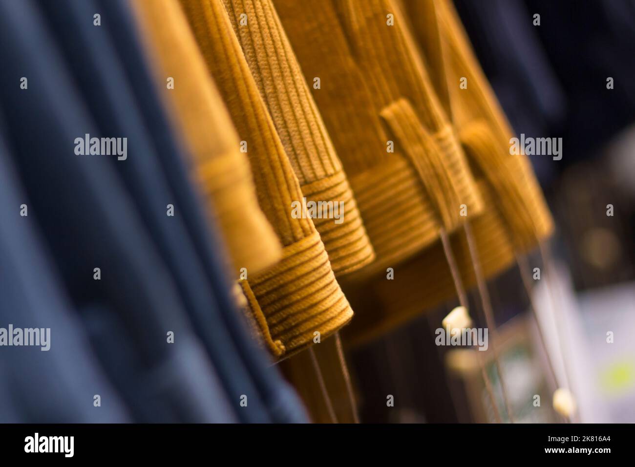 Close up on textile pattern background selection for men trousers, no ...