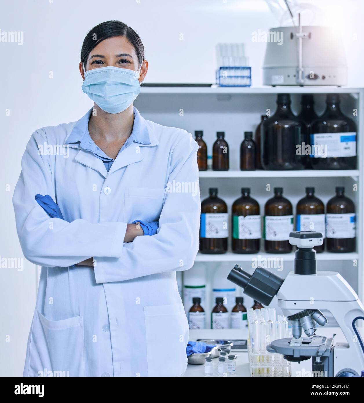 Female scientist wearing mask gloves hi-res stock photography and ...