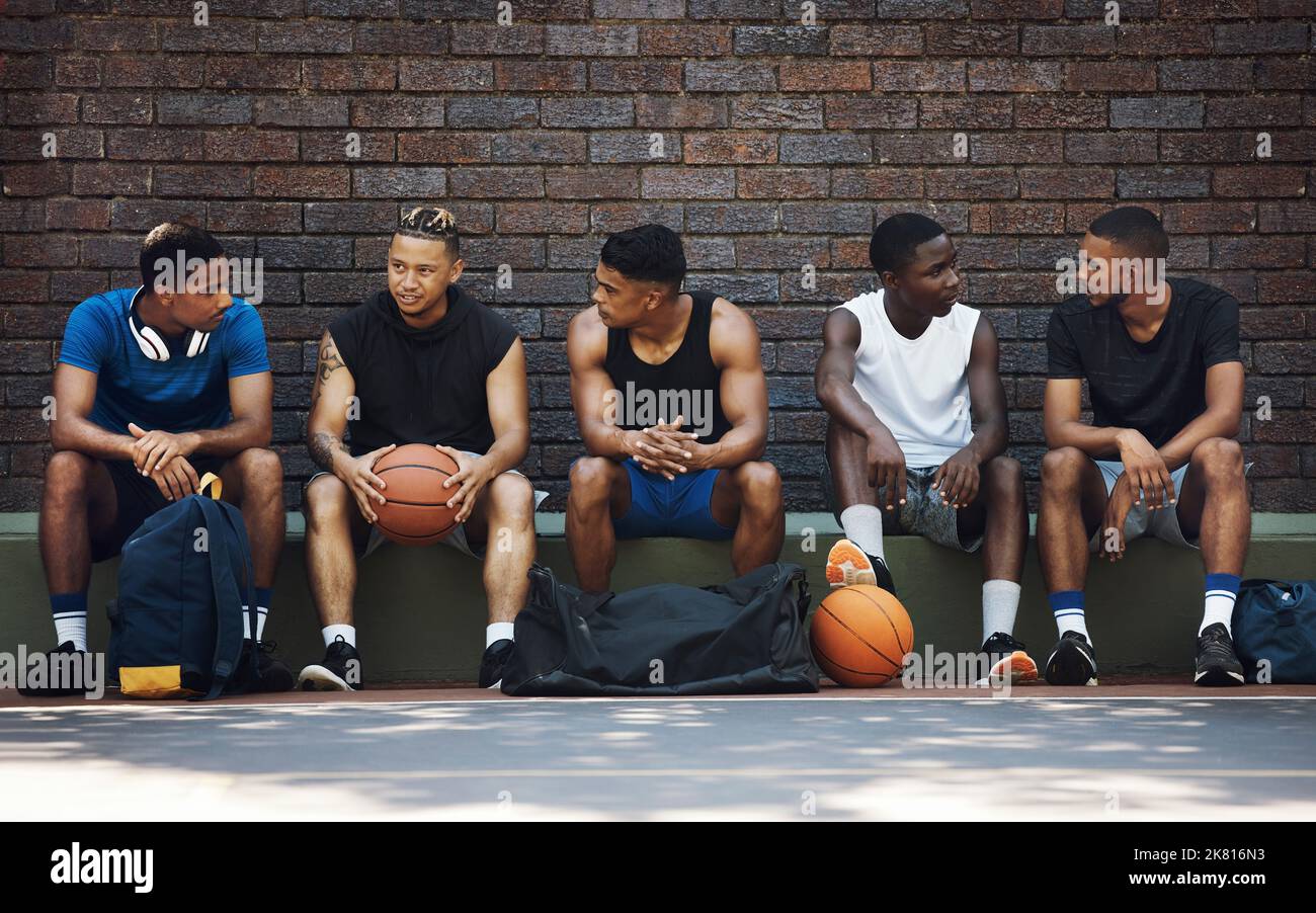 Basketball, sport team and teamwork break speaking after exercise ...
