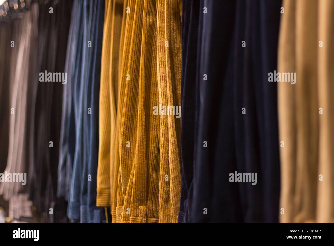 Close up on textile pattern background selection for men trousers, no ...