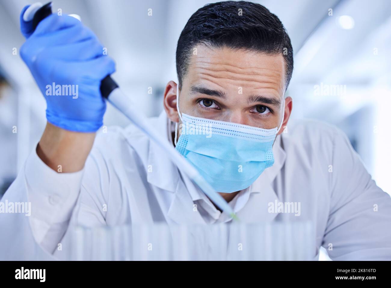 Testing chemical reactions. Cropped portrait of a handsome young male ...