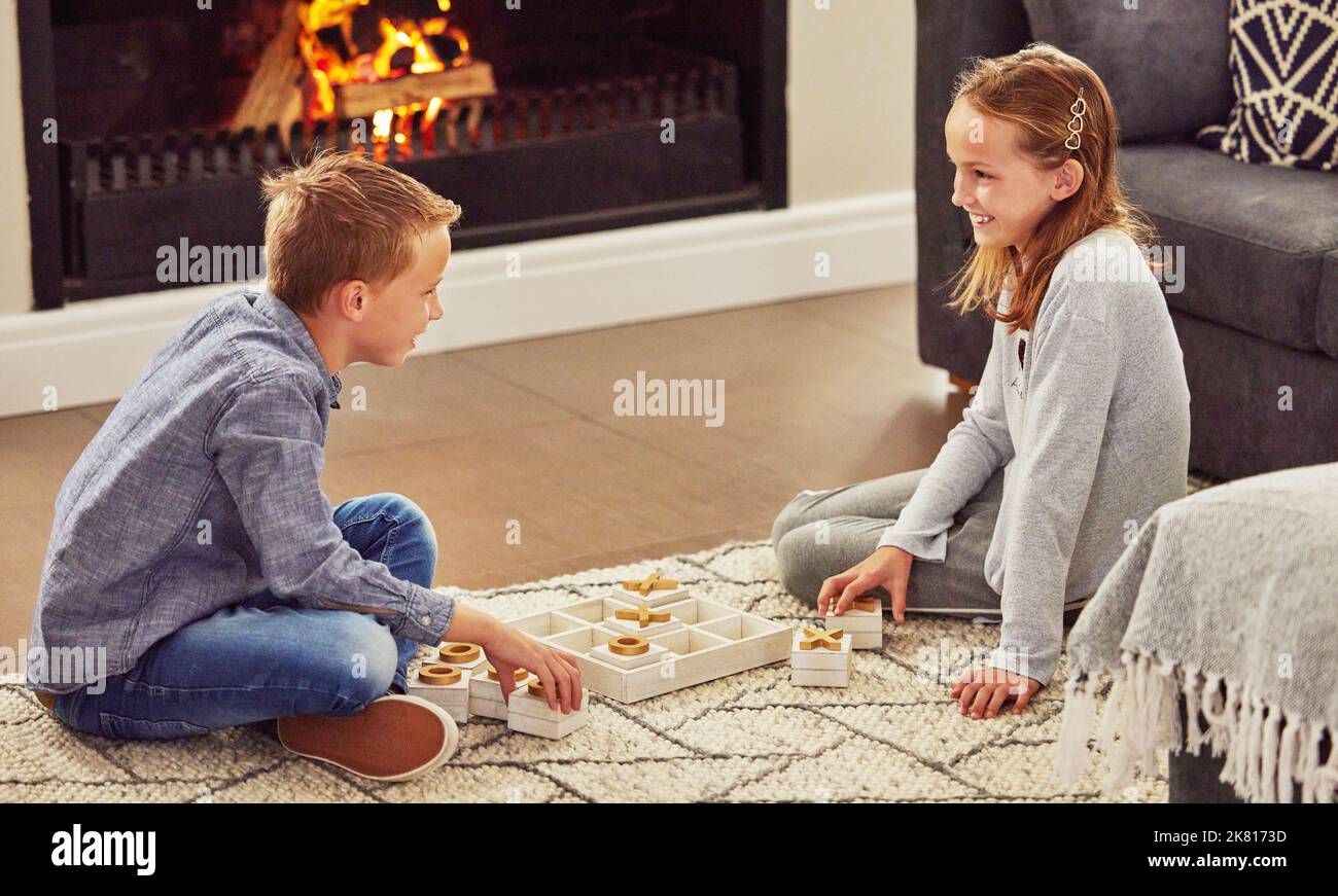 Ready to play. an adorable little girl bonding with her brother in the ...