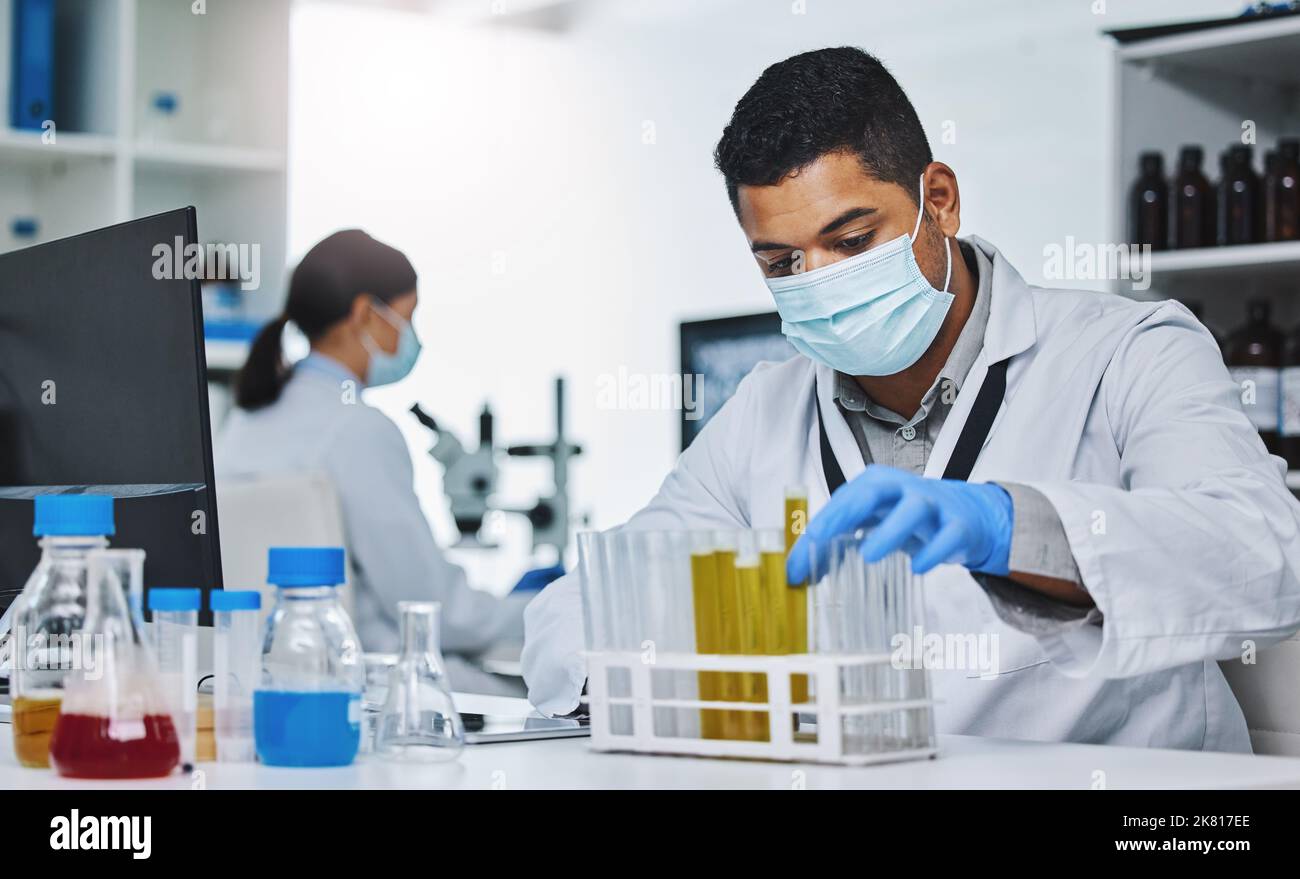 One step closer to finding that cure. two young researchers working in ...