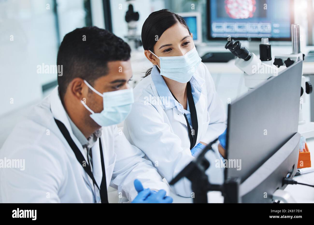 Science can be fun. two young researchers using a computer in a ...