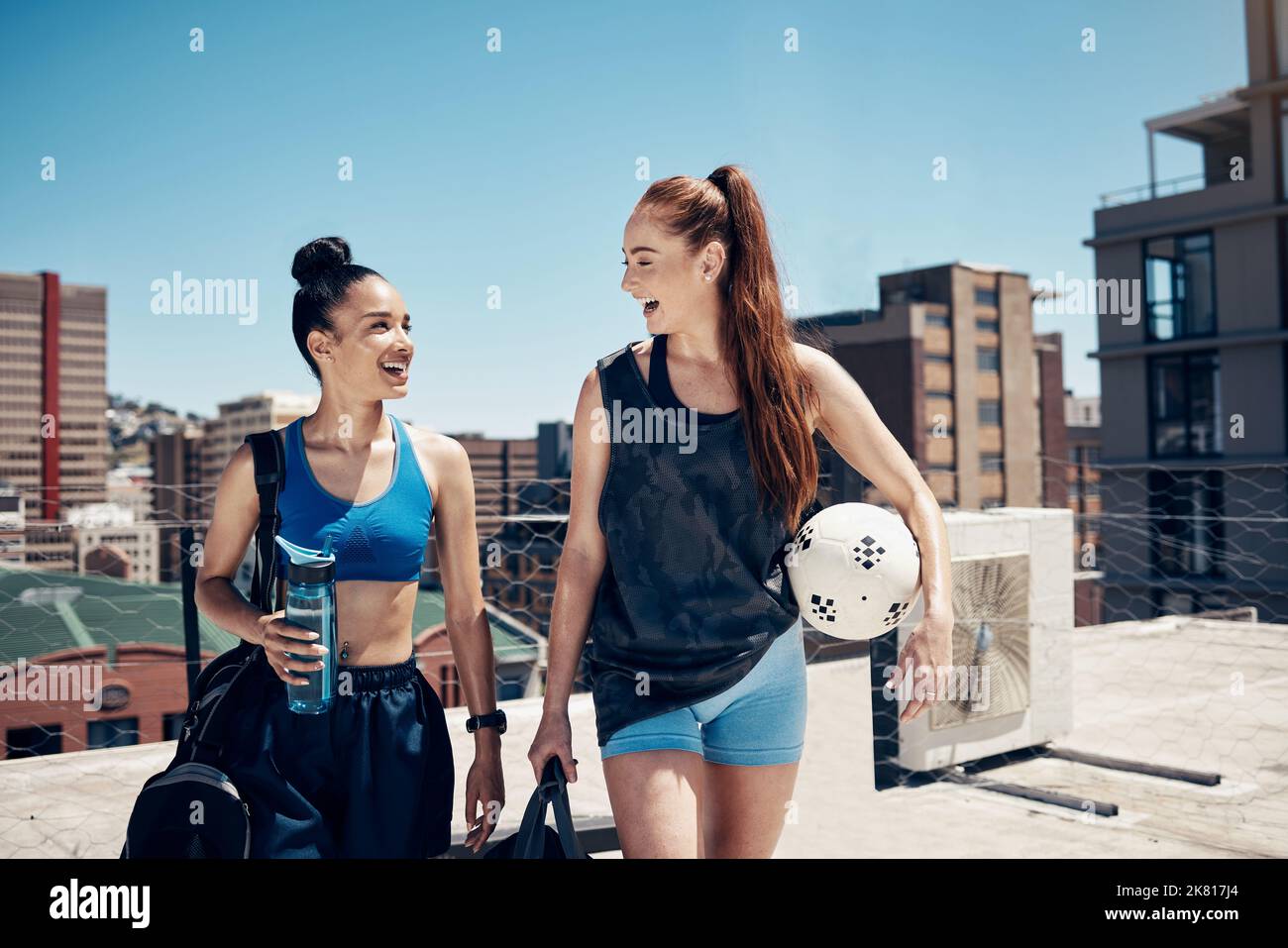 Women go to sports training with ball, rooftop city sports in Colombia ...