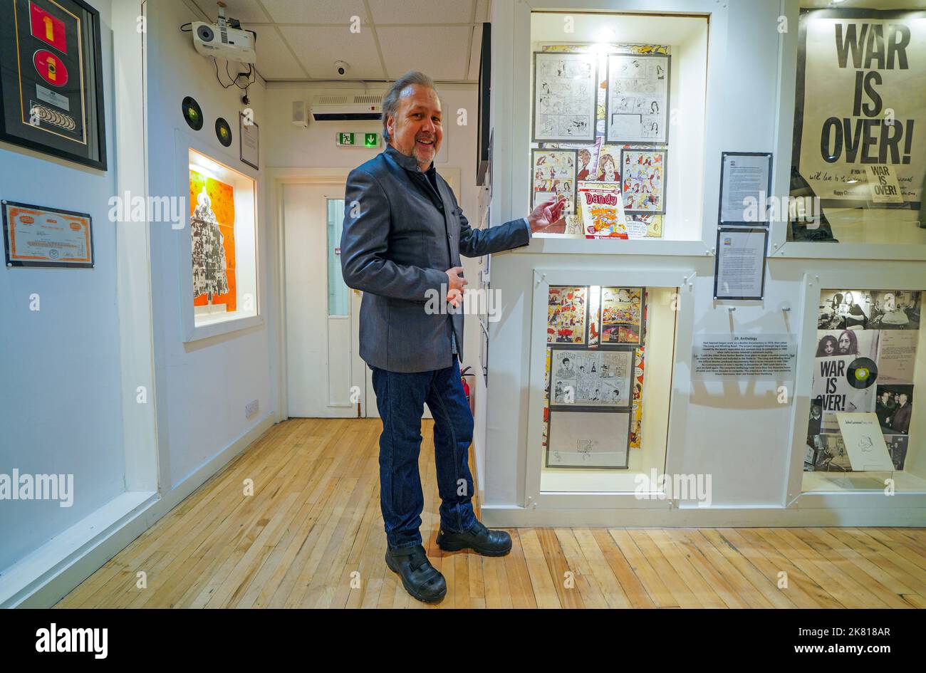 Dandy artist Nigel Parkinson next to his sketches and artwork of former ...