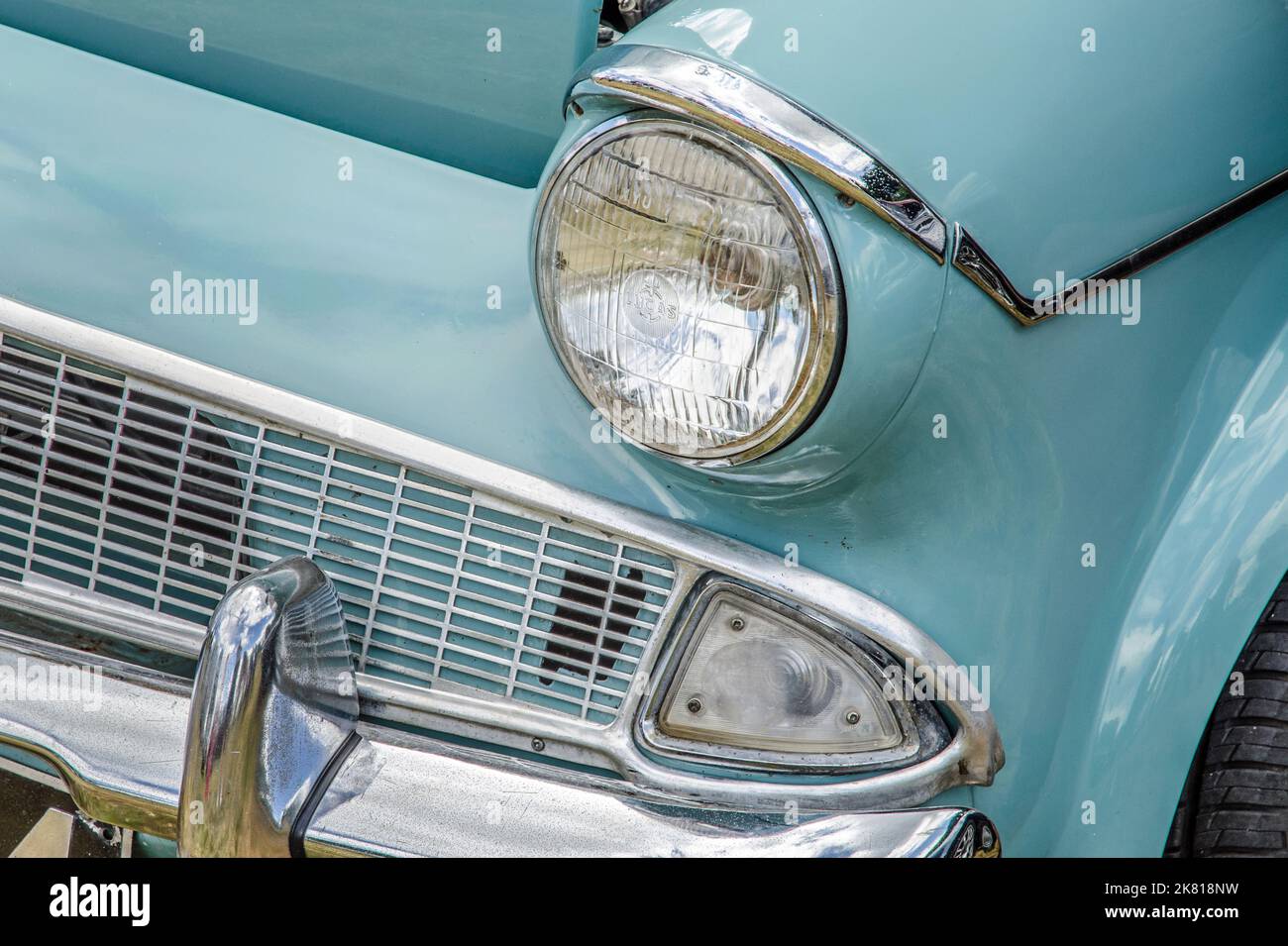 Front lights and radiator grille of a 1960 pale blue Ford Anglia Stock ...