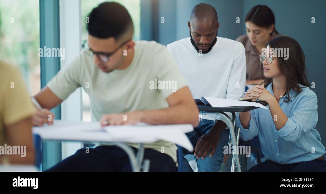 Turning windows into doors. a professor helping a student during an ...