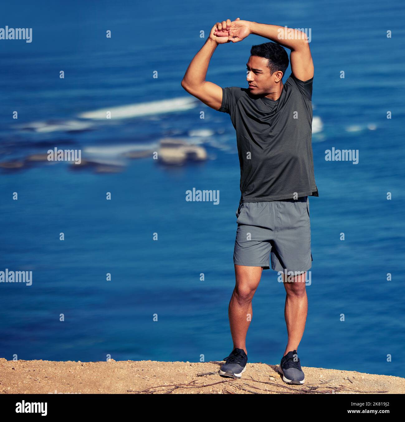 Prepping mind and body for an intense run. a sporty young man ...