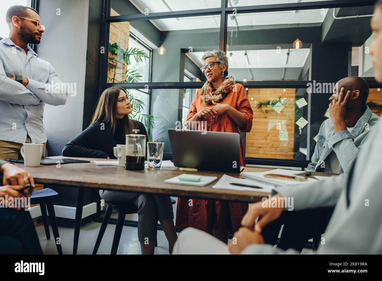 Creative entrepreneurs having a group discussion during a meeting in a ...